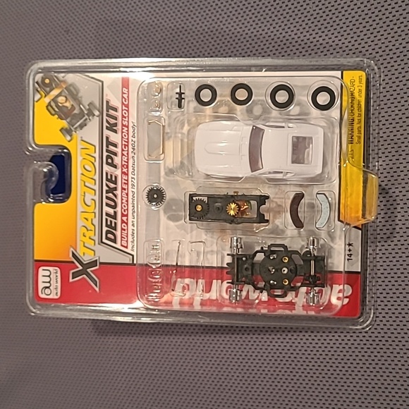 Auto World | Toys | Auto World Xtraction 973 Datsun 24z Slot Car Deluxe ...